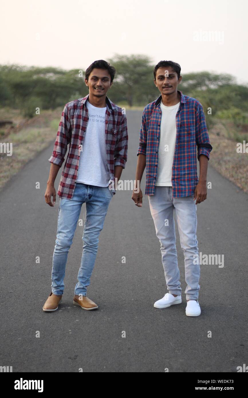 Twin brothers standing hi-res stock photography and images - Alamy