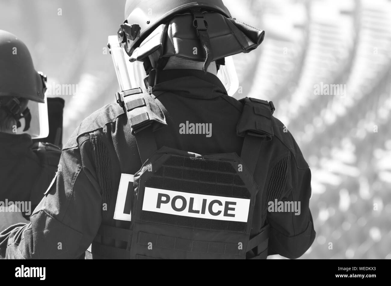 Police officer rear view Black and White Stock Photos & Images - Alamy
