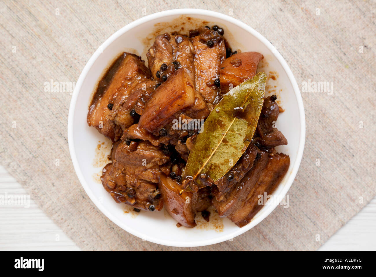 Homemade Filipino Adobo Pork in a bowl, top view. Flat lay, from above ...