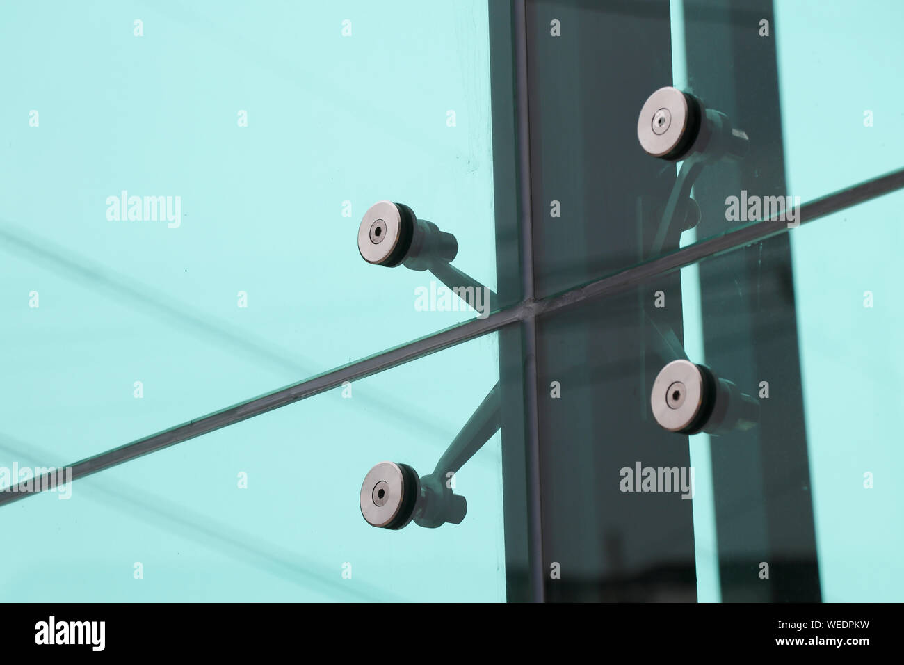 Point support glass for hold with structure Stock Photo - Alamy