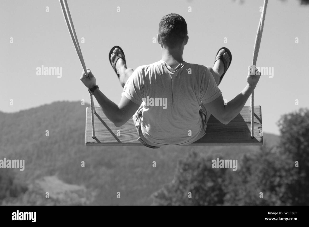Man swing hi-res stock photography and images - Alamy
