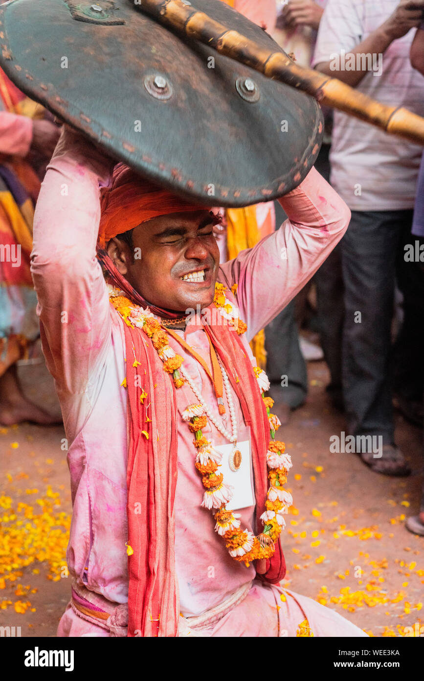 Indian women beating man stick hi-res stock photography and images - Alamy