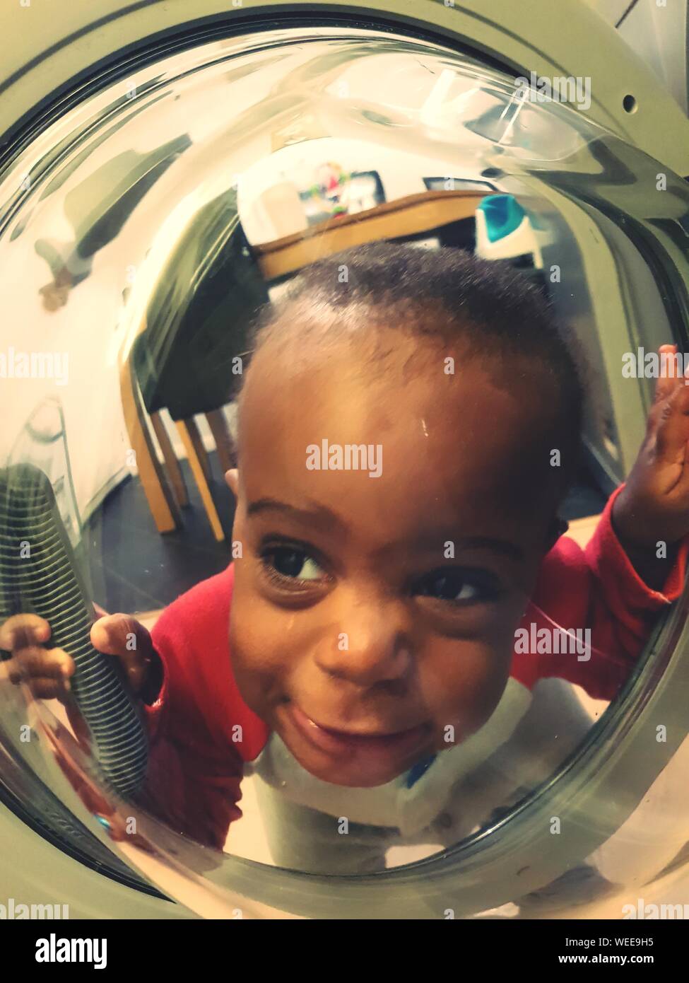 Child washing machine hi-res stock photography and images - Alamy