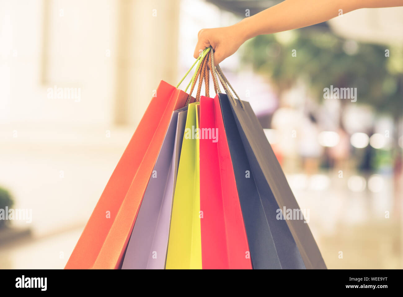 Woman carrying heavy shopping hi-res stock photography and images - Alamy