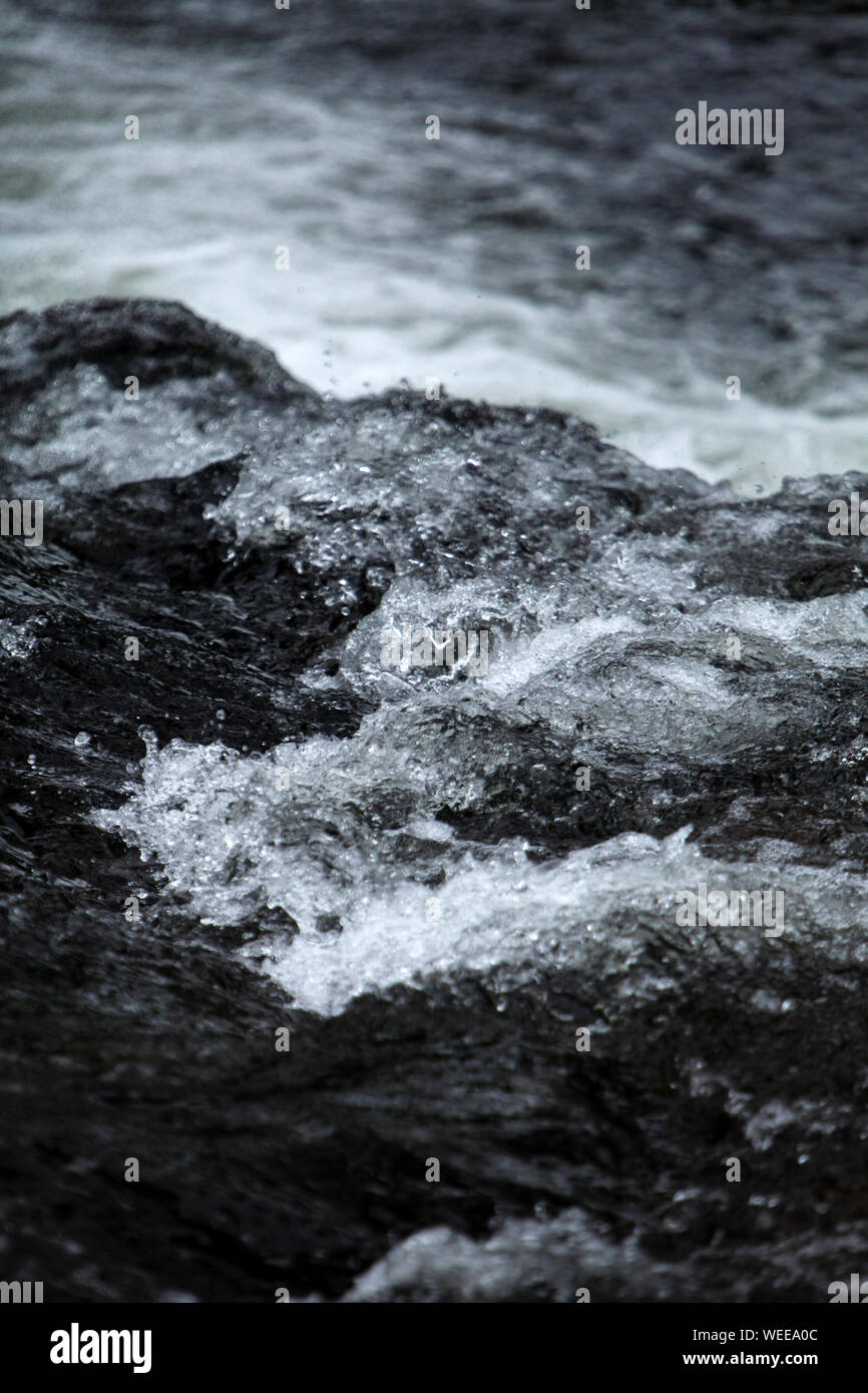 tumbling rushing waters of a turbulent shallow stream or river ...
