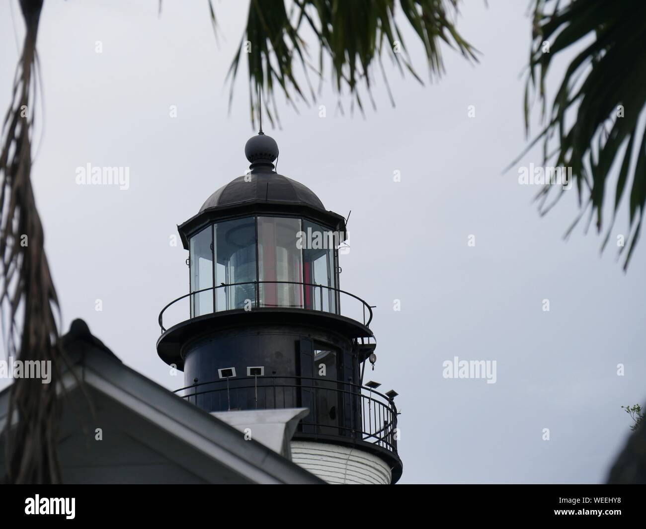 Distant shot of the top part of the Key West lighthouse, a popular ...