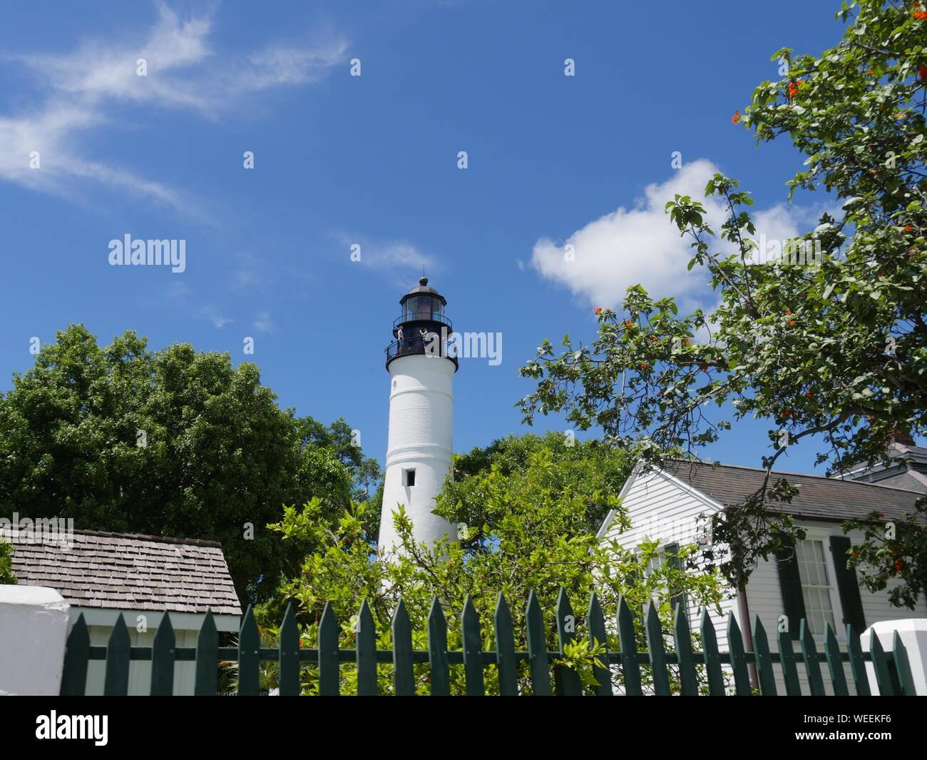 Wide shot of the Key West lighthouse and the keeper's quarters. The ...