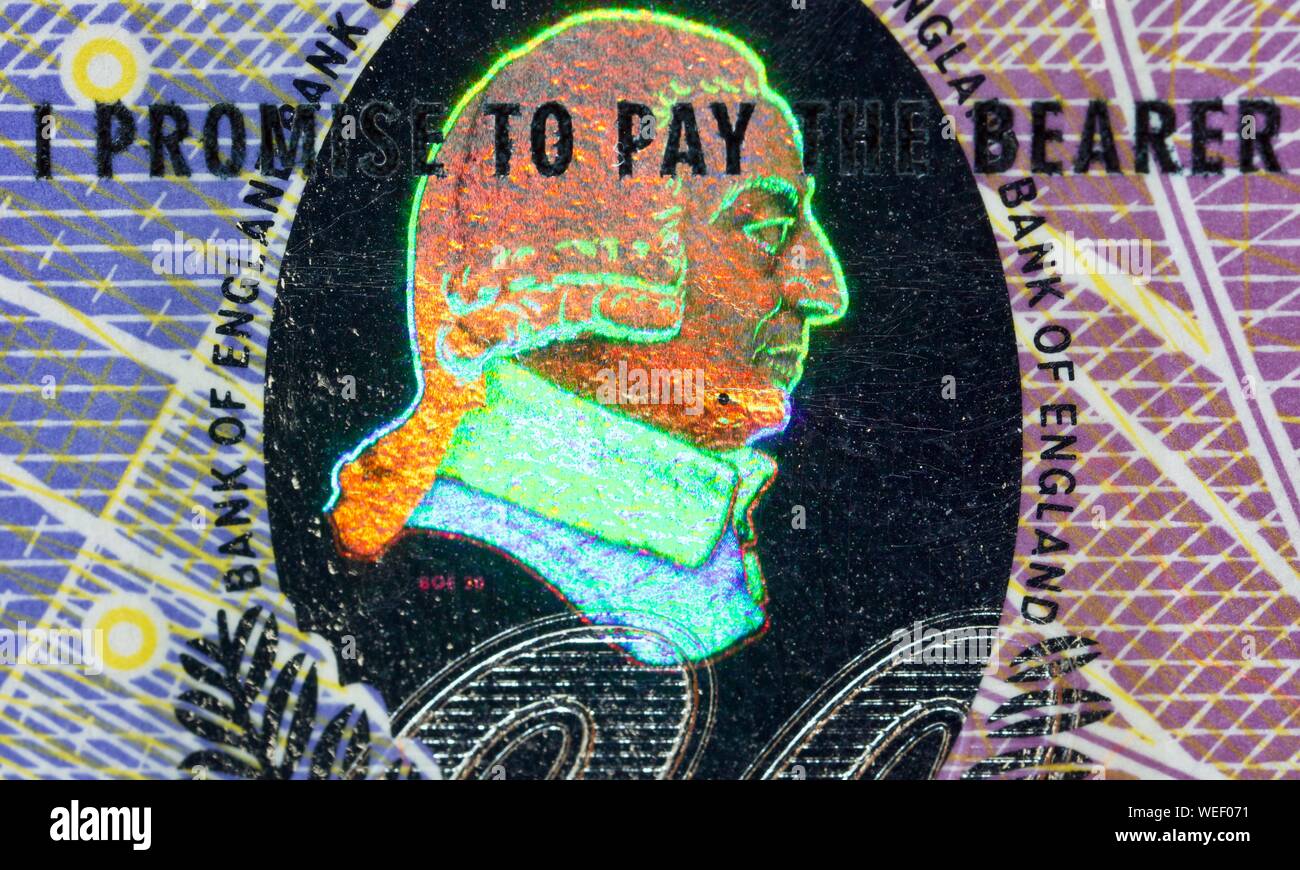 Close-up of the twenty pound banknote hologram shows a multi-coloured ...