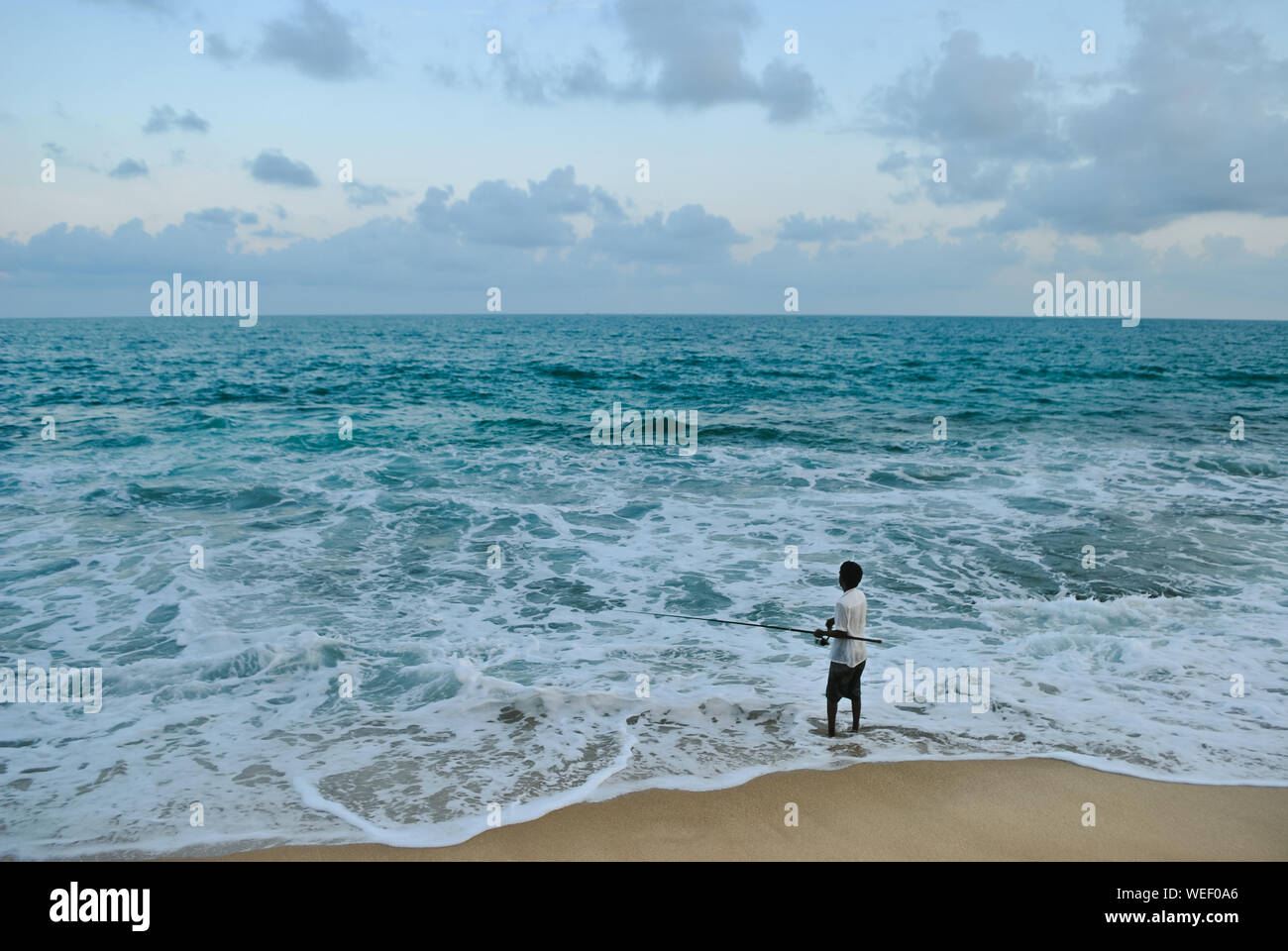 Man fishing in sea dusk activity hi-res stock photography and images ...