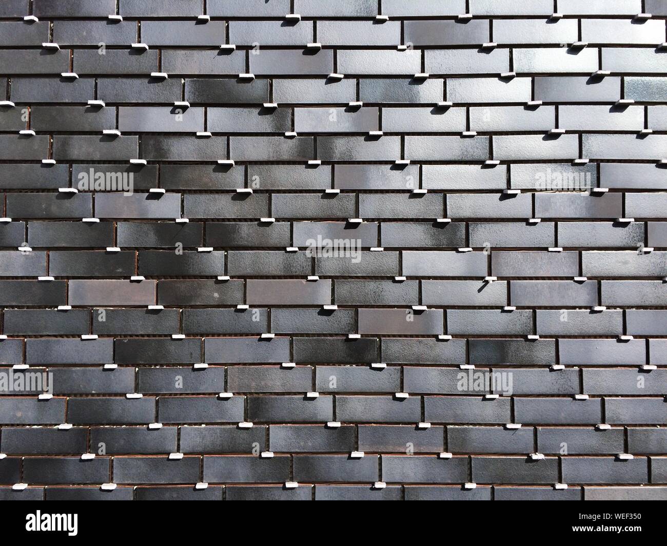 Patterned brick wall hi-res stock photography and images - Alamy