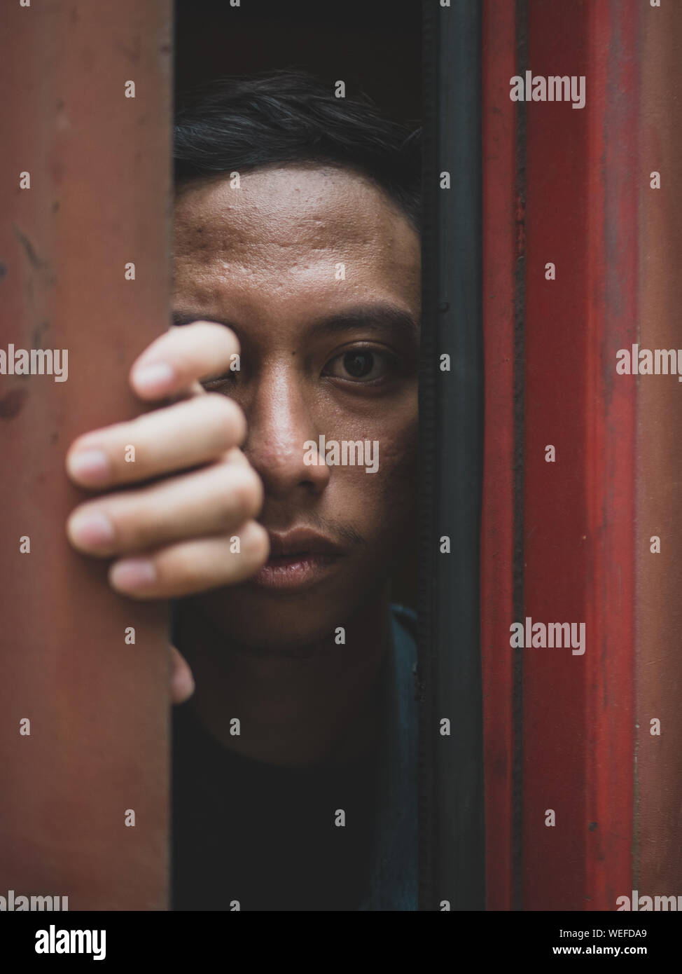 Peeking Through Door High Resolution Stock Photography and Images - Alamy