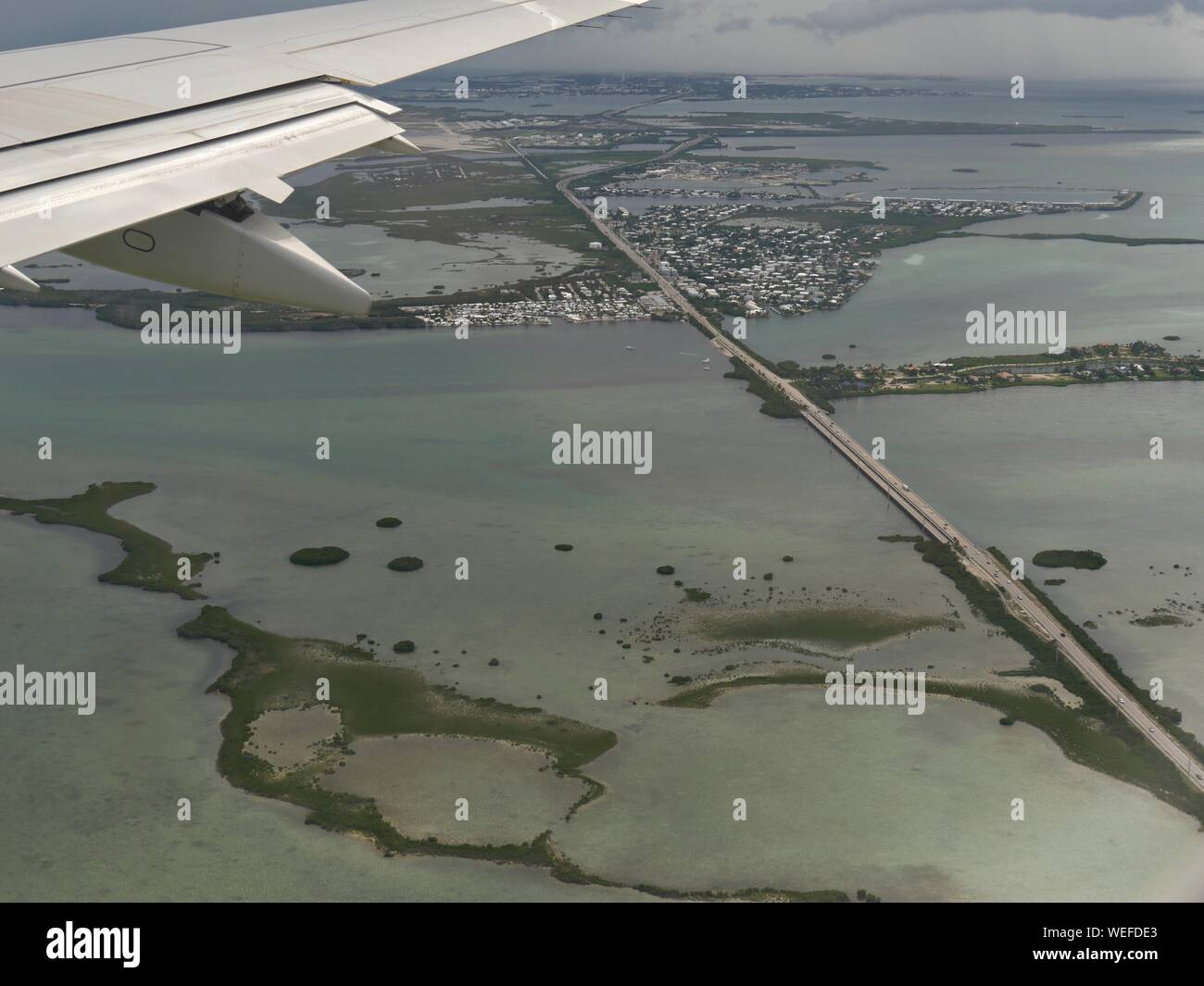 Medium wide aerial shot of the US Highway 1 with the Key West, with an ...