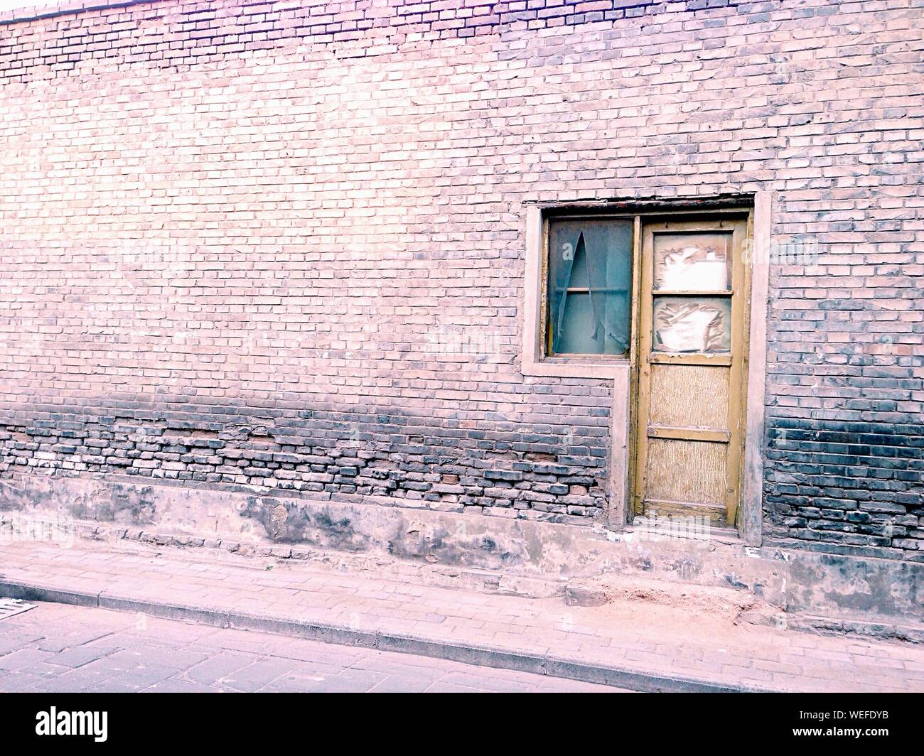 Brick door window hi-res stock photography and images - Alamy