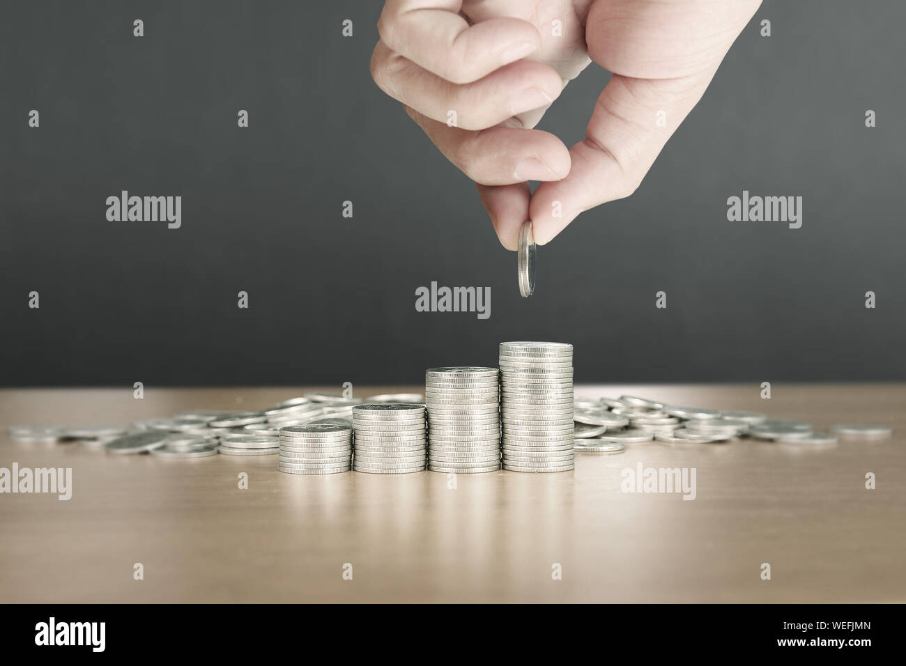 Coins stacked on each other in a different positions Stock Photo - Alamy