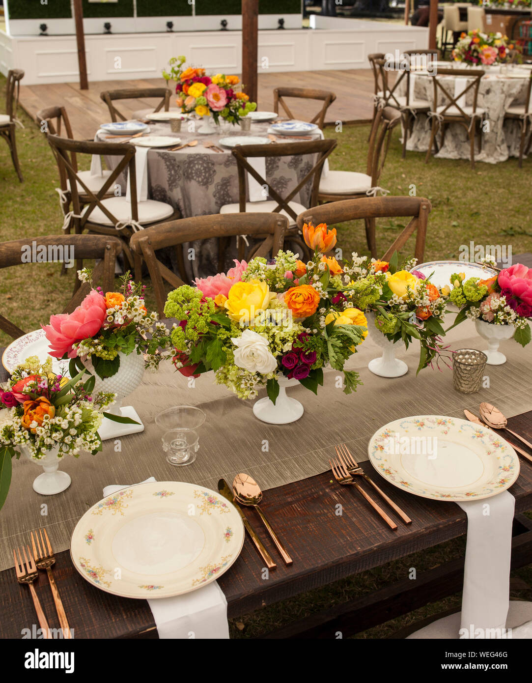 arrangement of tables with antique plates for reception Stock Photo - Alamy