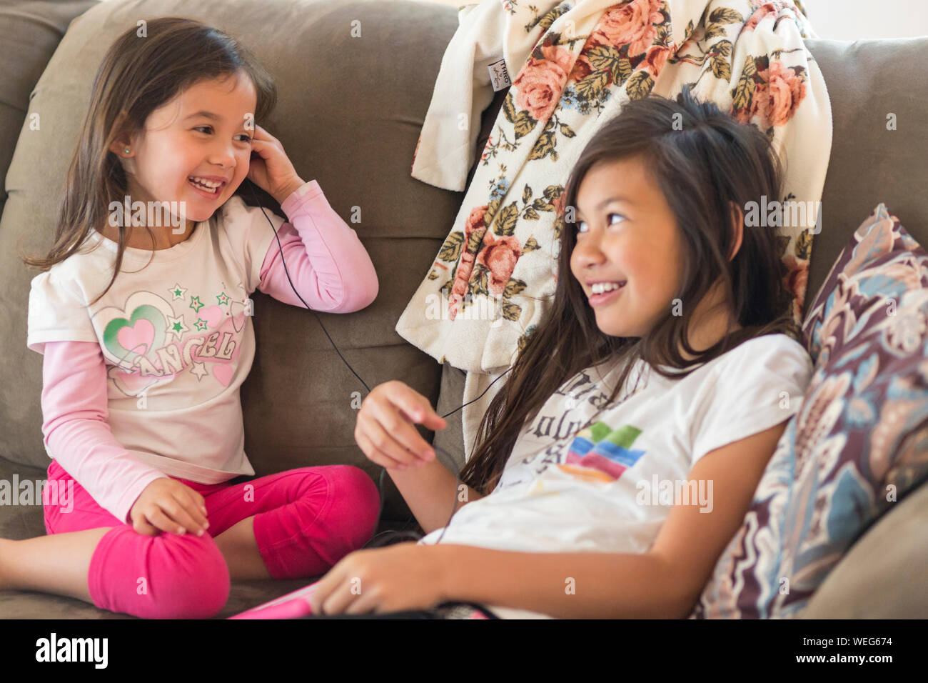 Sharing earbuds hi-res stock photography and images - Alamy