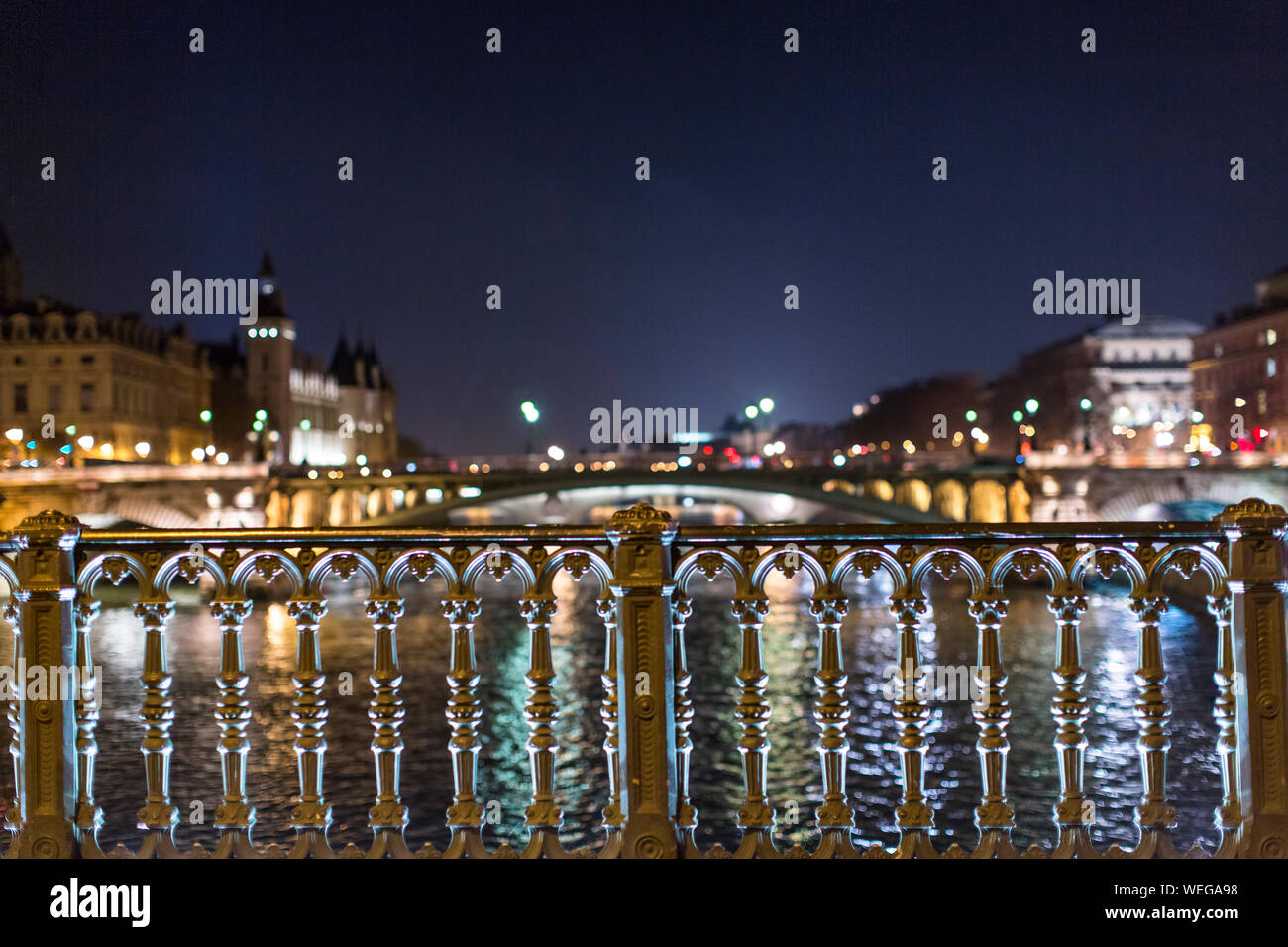 The railings of the Pont d'Arcole at night, with Pont Notre Dame and ...