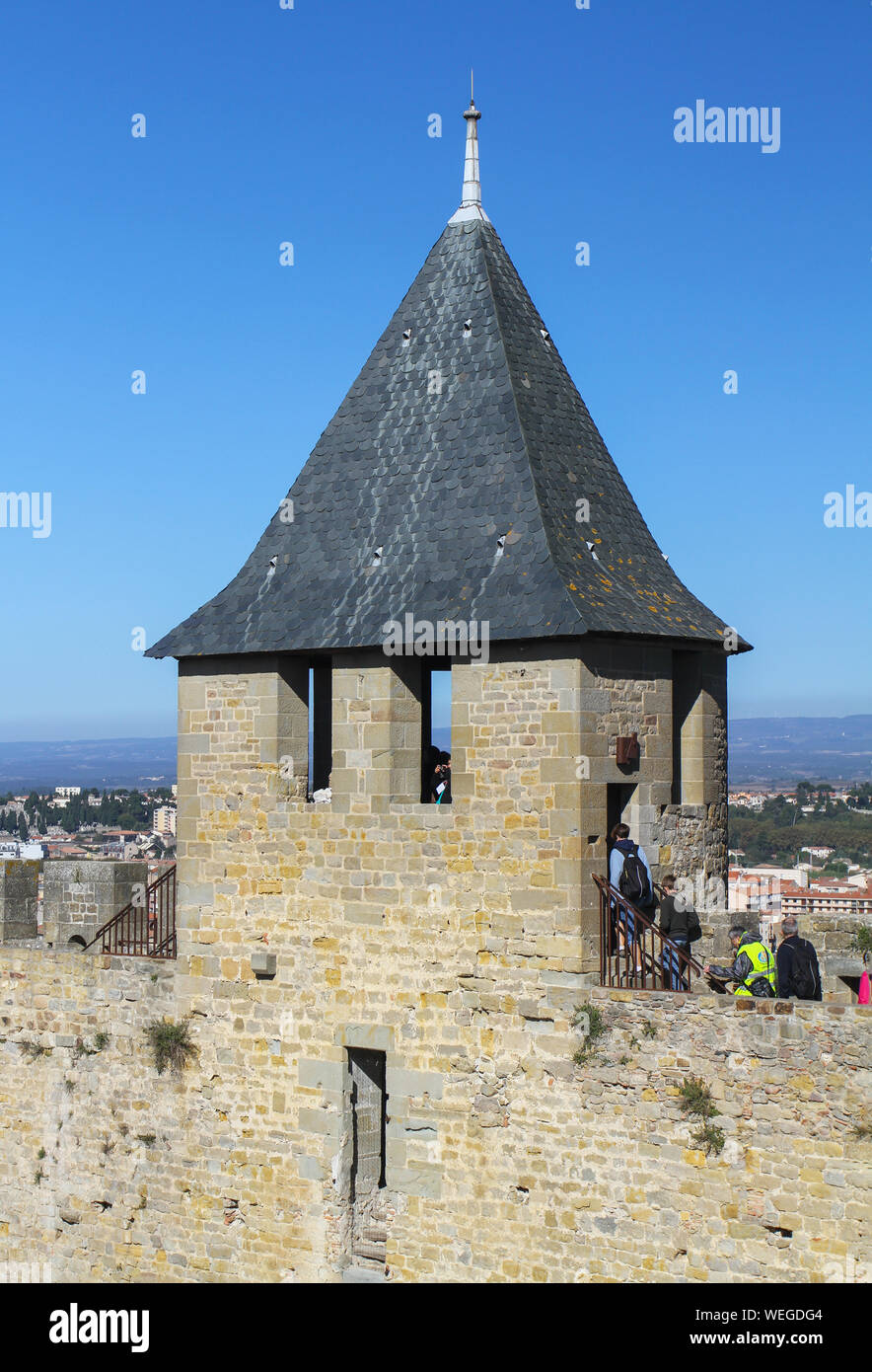 Tourists enter watchtower on top of ramparts, Carcassonne, Aude ...