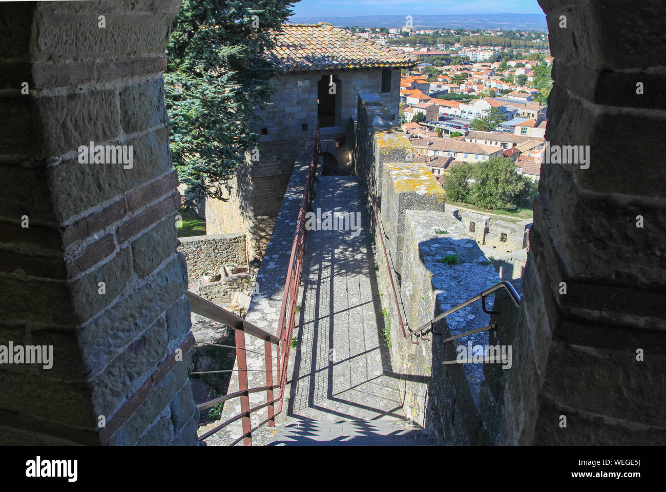 Walkway on top of crenellated perimeter rampart wall and battlements ...