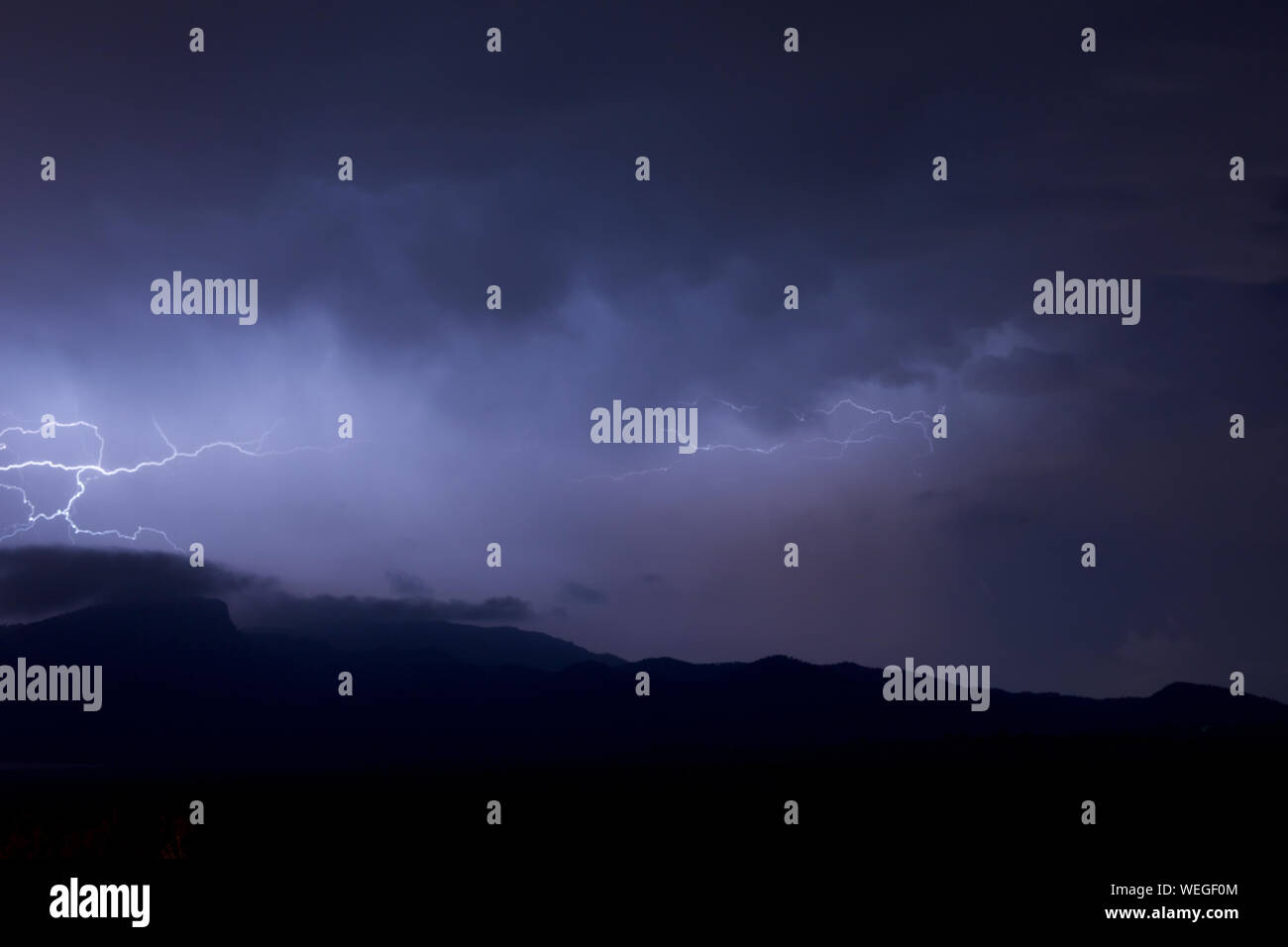 Lightning storm at night Stock Photo - Alamy
