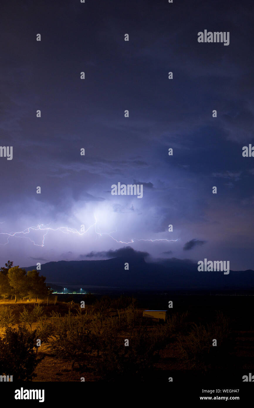 Lightning storm at night Stock Photo - Alamy