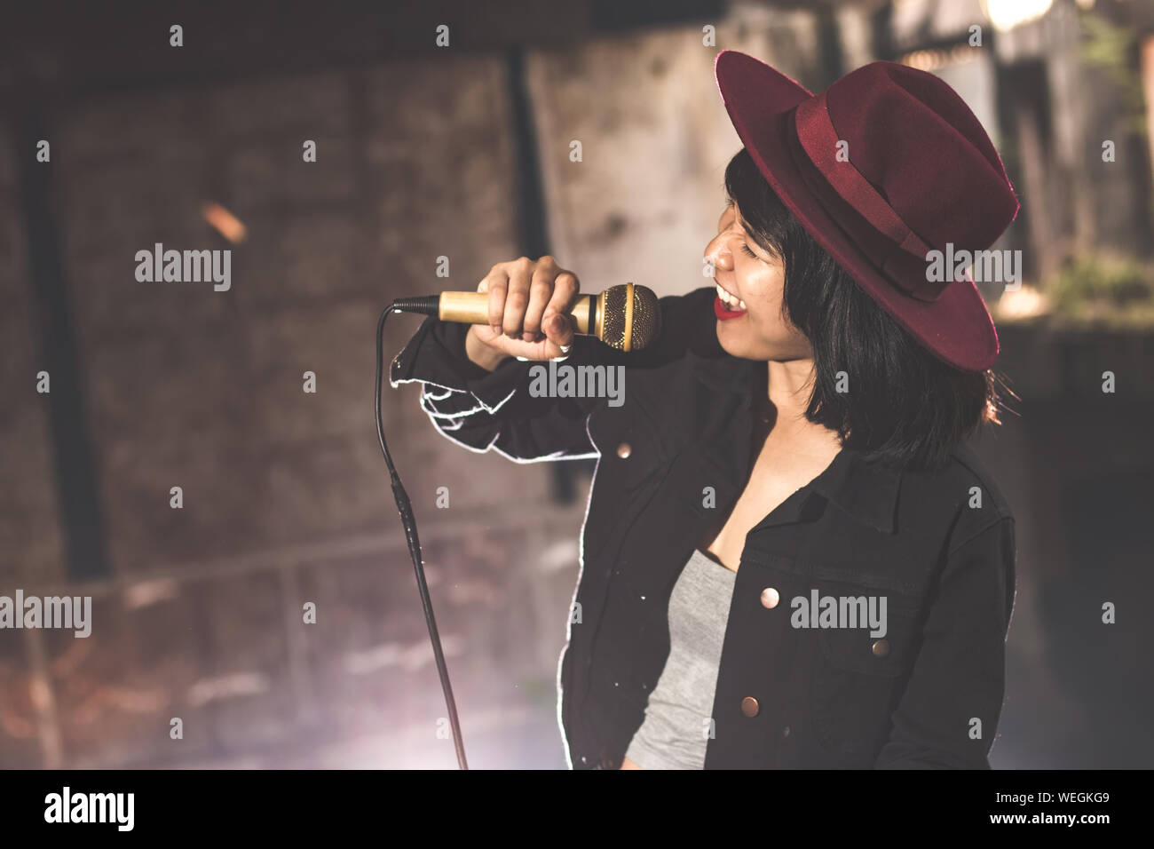 Indian woman singing microphone hi-res stock photography and images - Alamy