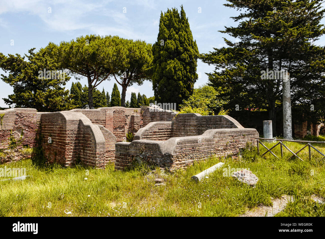 Glimpse of the ancient Roman ruins of Ostia Antica with its lush ...