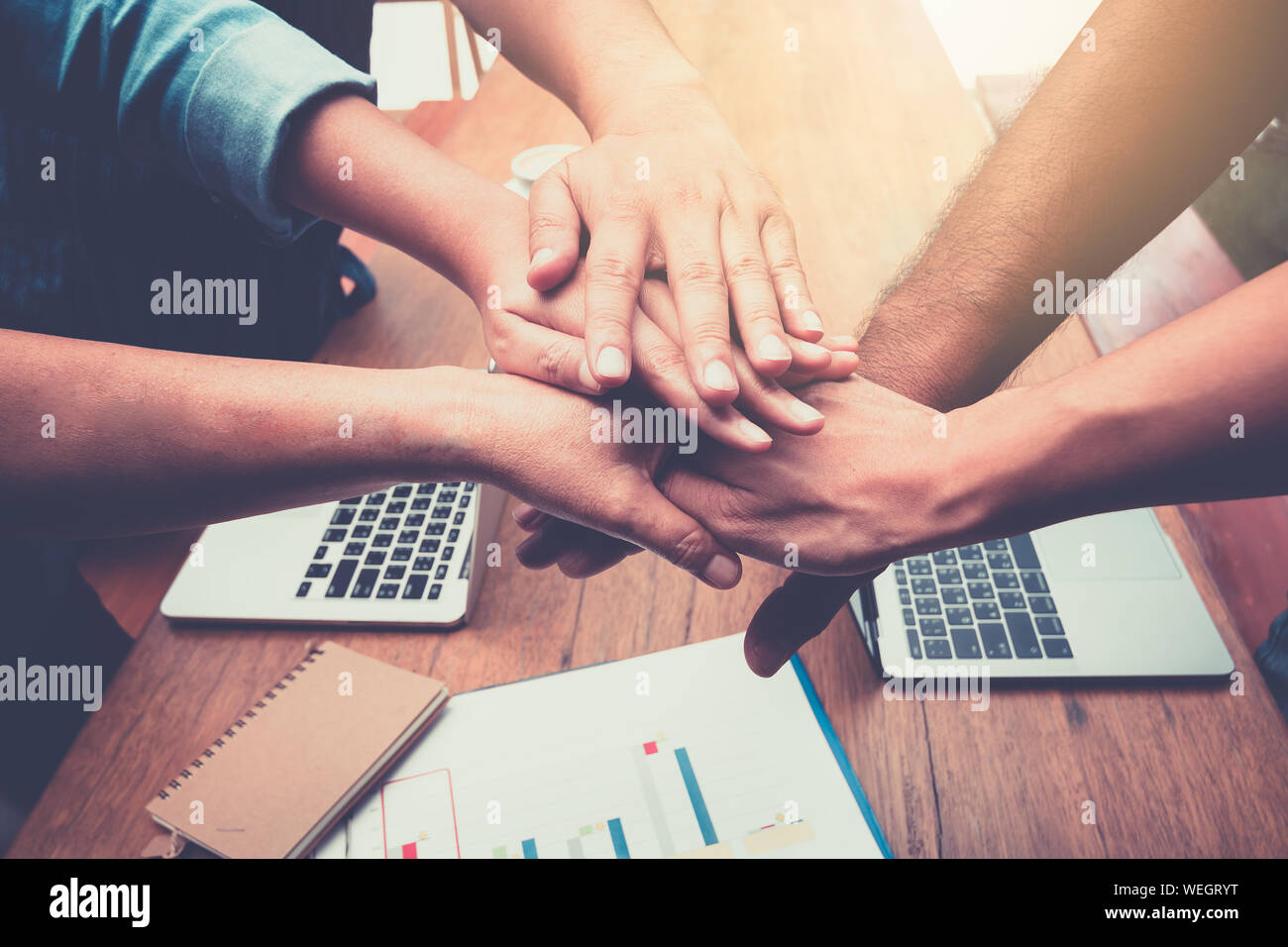Group of people putting hands up hi-res stock photography and images ...