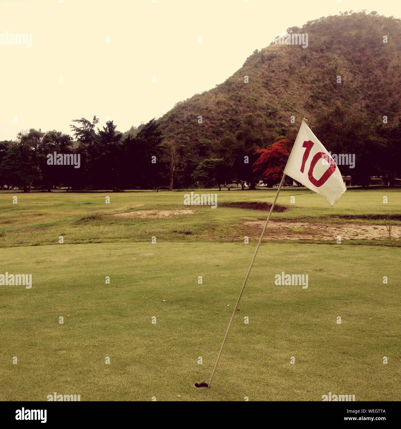 Golf Hole Number 10 On Field Against Mountain Stock Photo - Alamy
