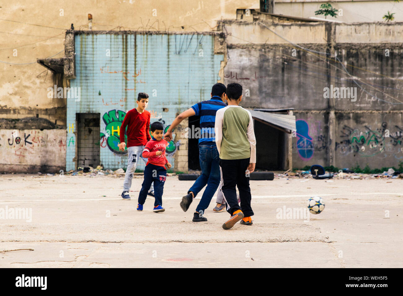Children playing football in square hi-res stock photography and images ...