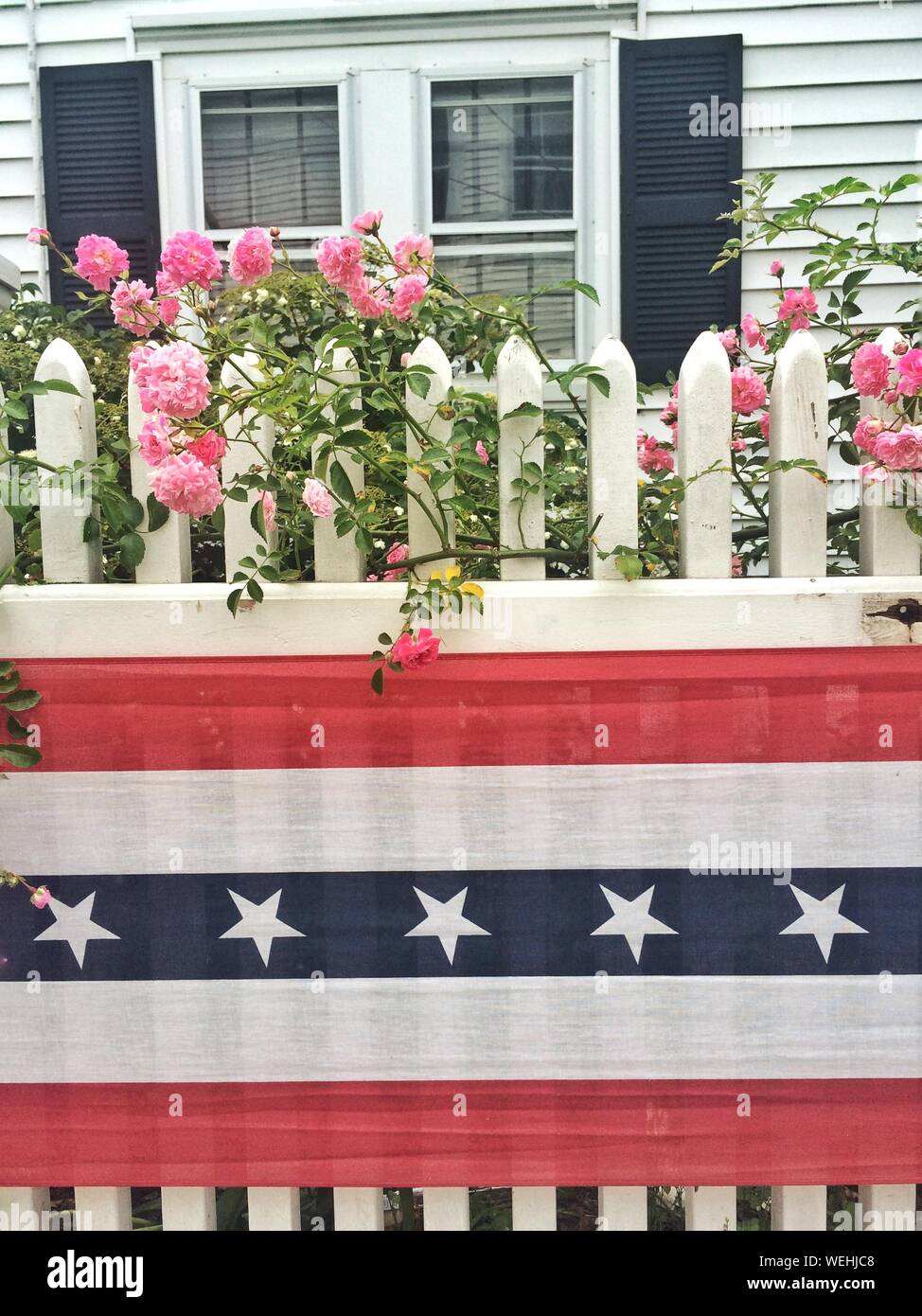 Flag On Fence Outside House Stock Photo - Alamy