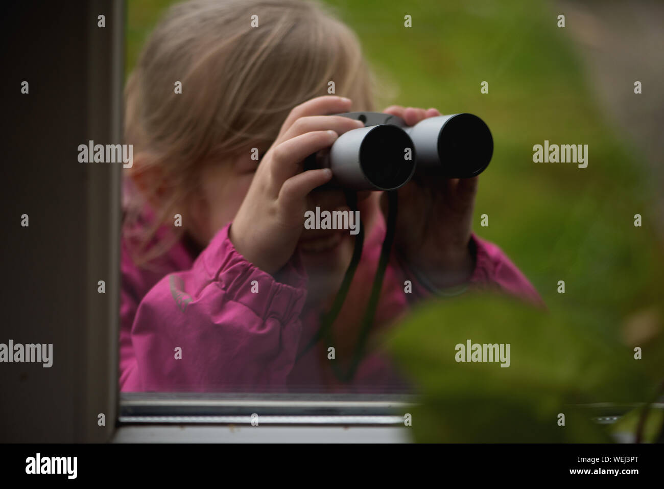 Binoculars looking through window hi-res stock photography and images ...