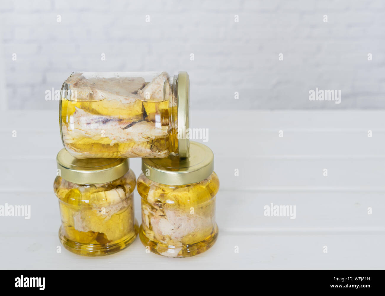 Tuna packed in glass jars on white background. Copy space Stock Photo ...
