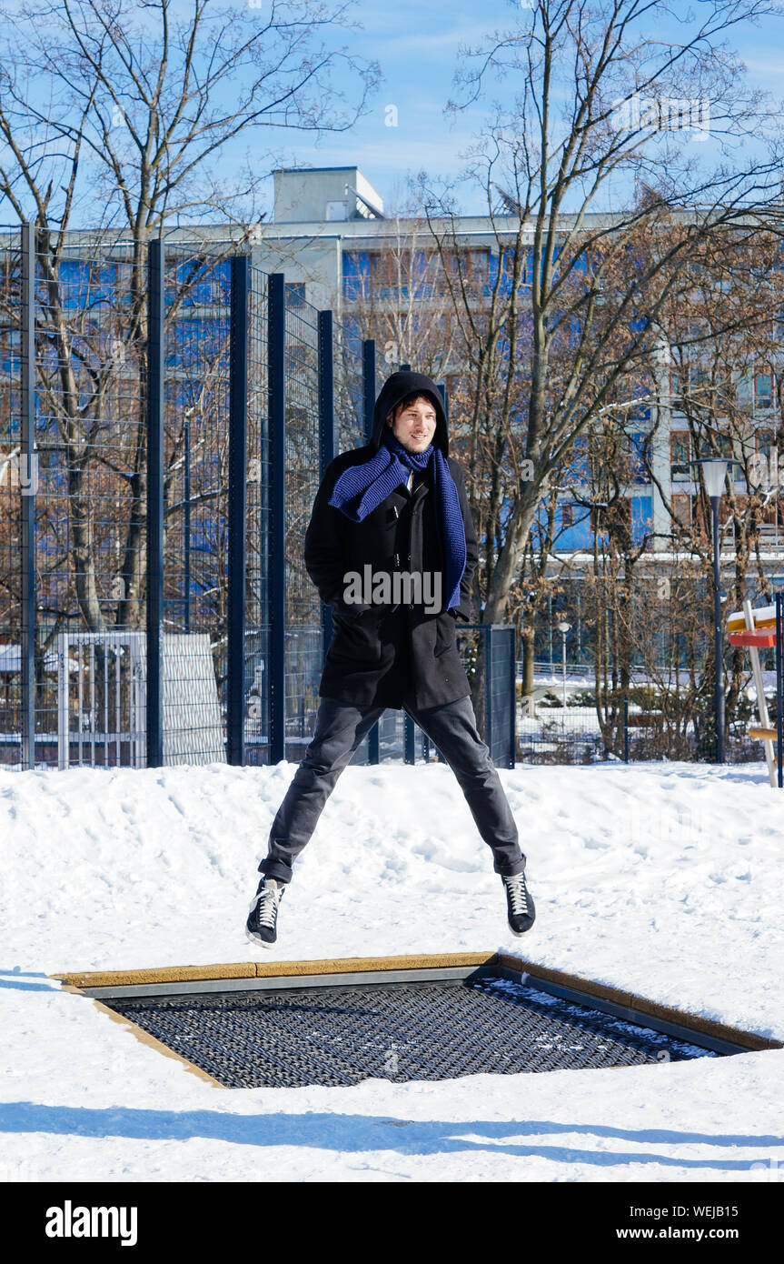 Man jumping in the snow hi-res stock photography and images - Alamy
