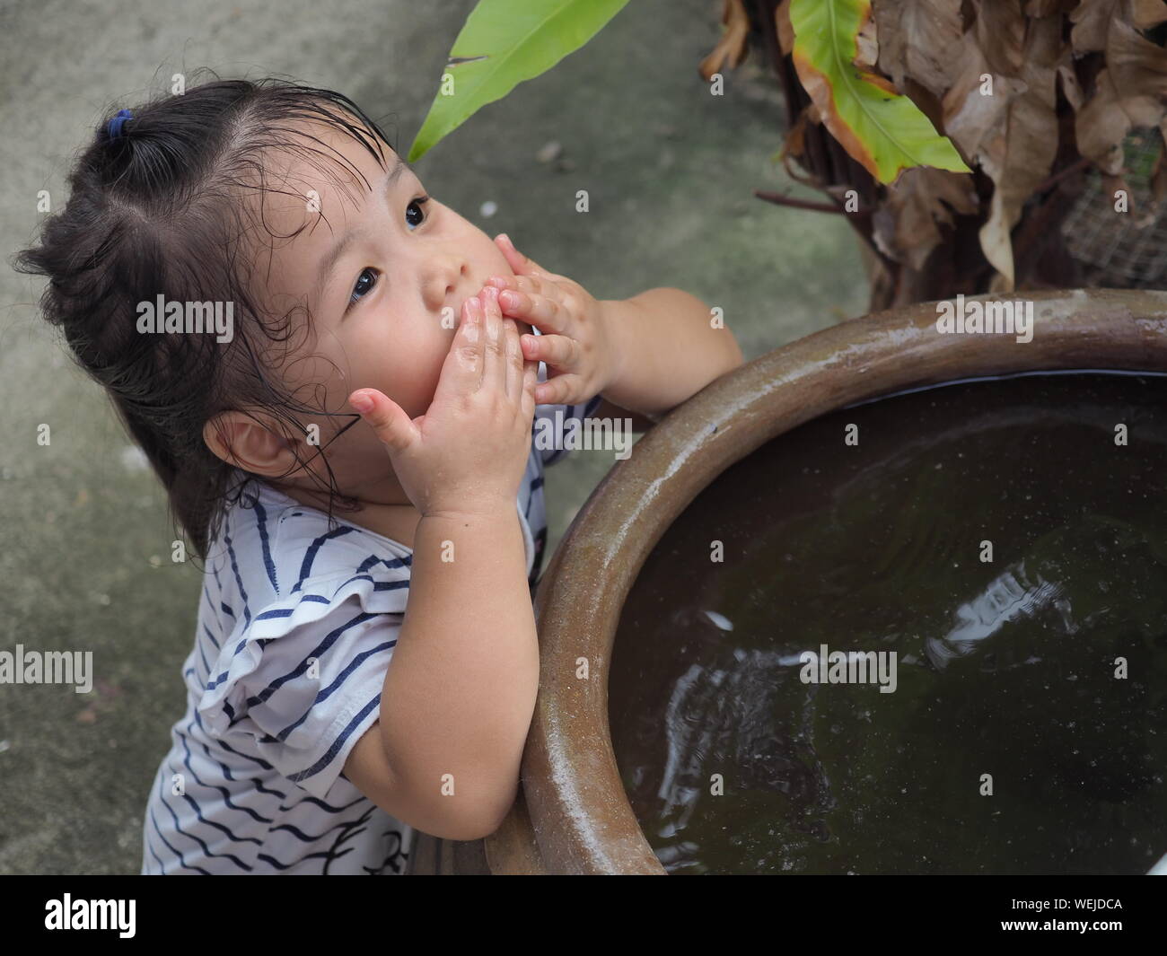 Cute baby in water hi-res stock photography and images - Alamy
