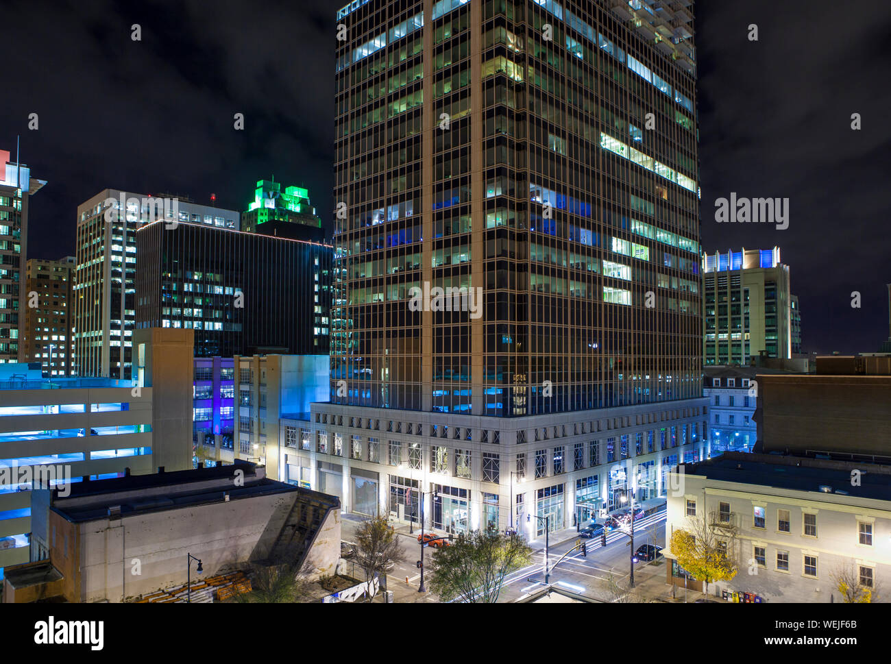 Close rooftop view of modern city at night, Raleigh North Carolina ...