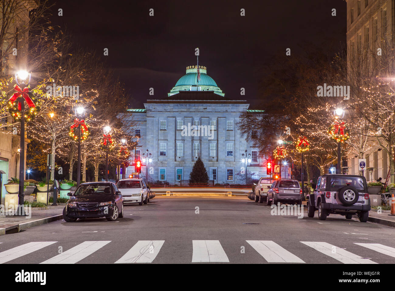 street level scene at night of Raleigh, North Carolina and capital ...