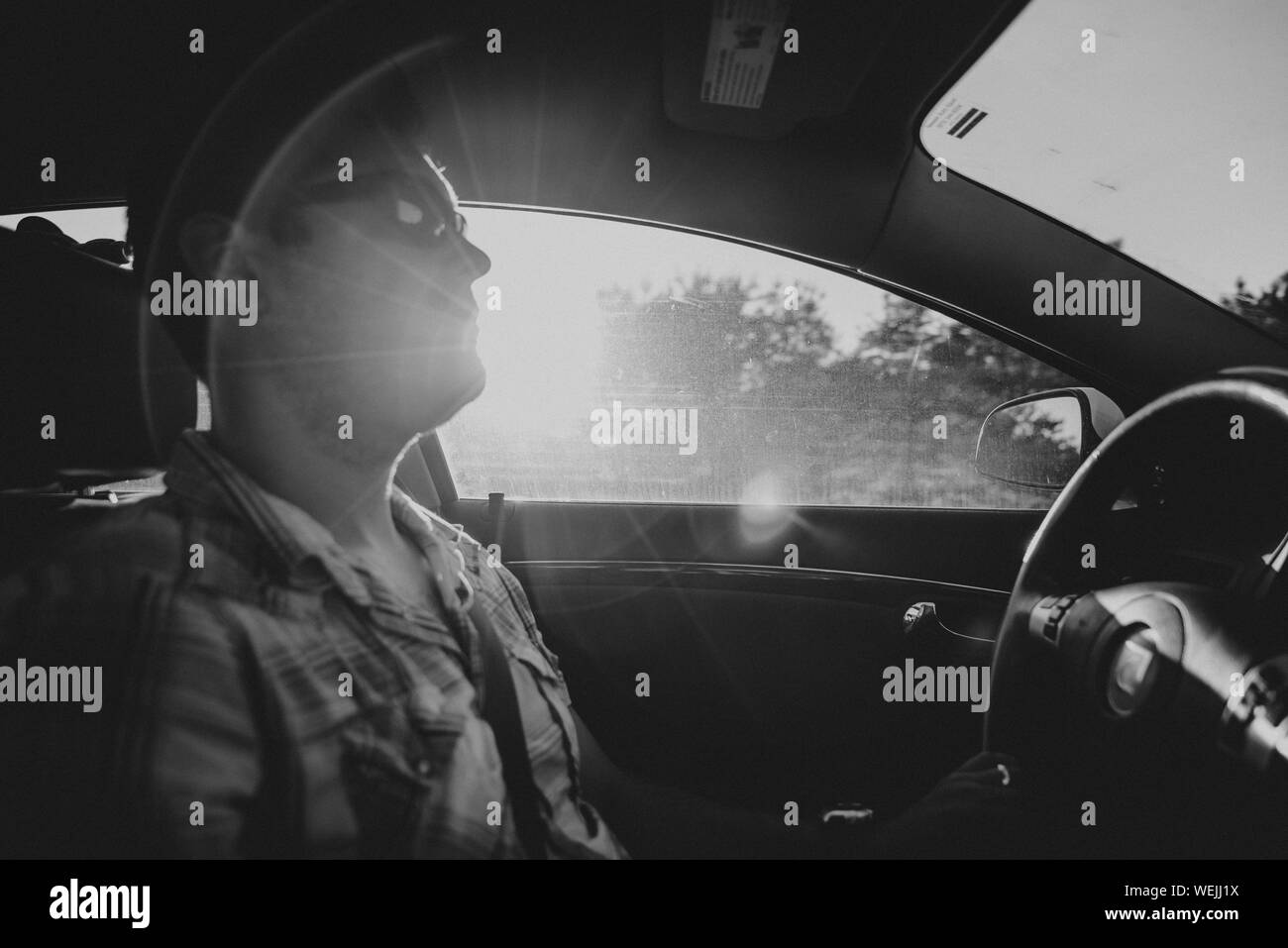 Person driving car Black and White Stock Photos & Images - Alamy