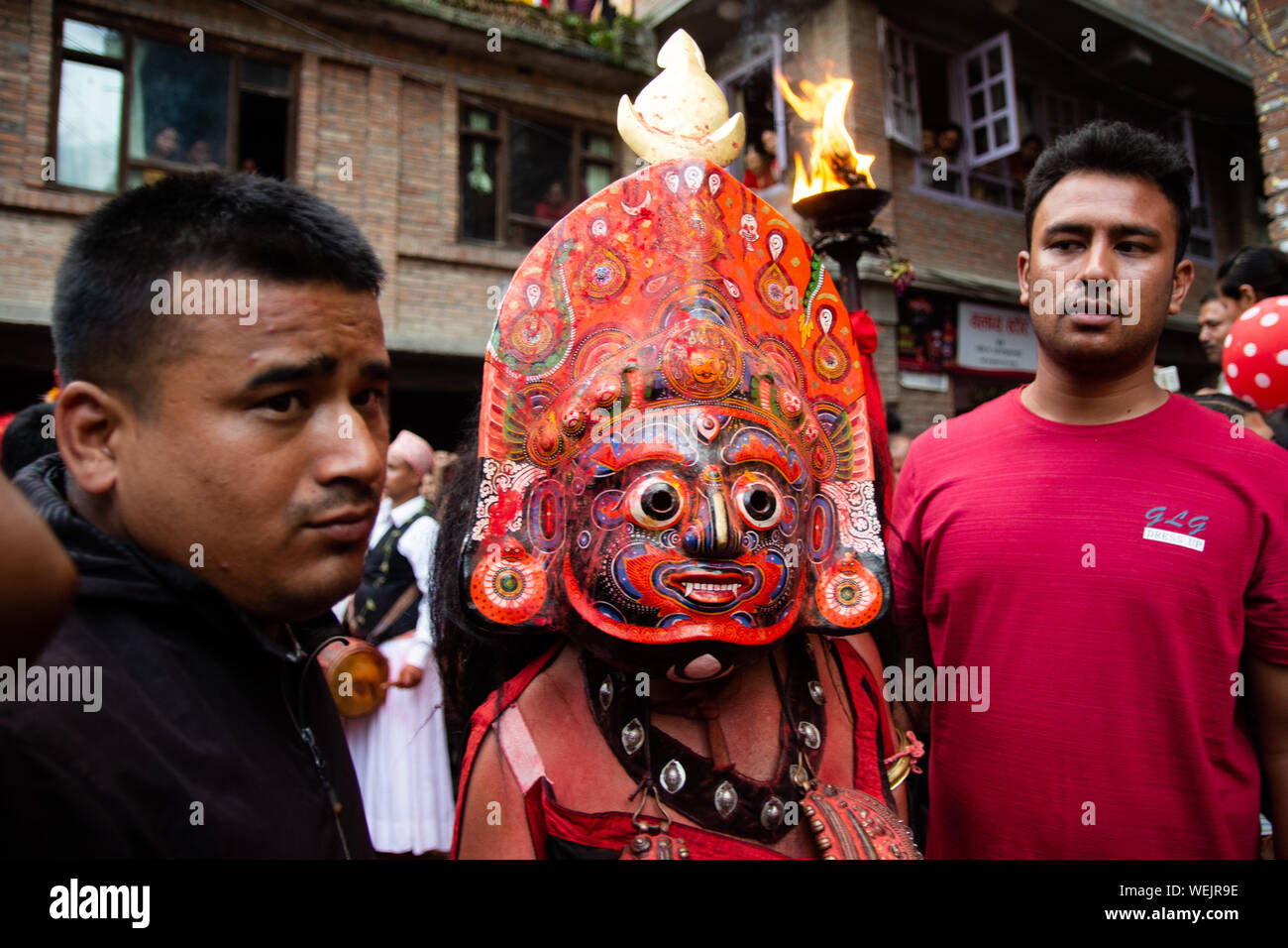 A traditional masked dancer performs in the Nil Barahi dance festival ...