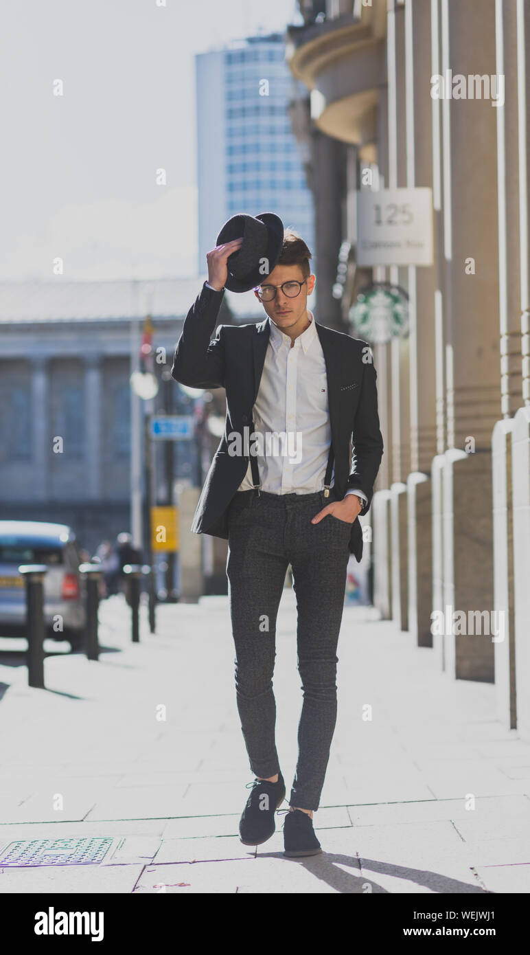 Man walking on city street hi-res stock photography and images - Alamy
