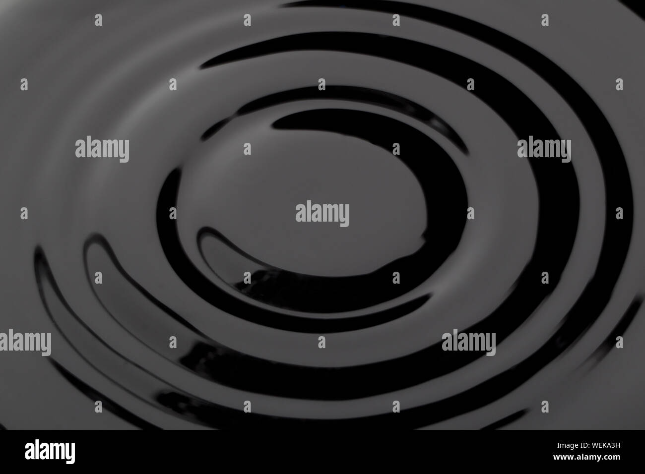 Abstract photo of a black swirling liquid Stock Photo - Alamy