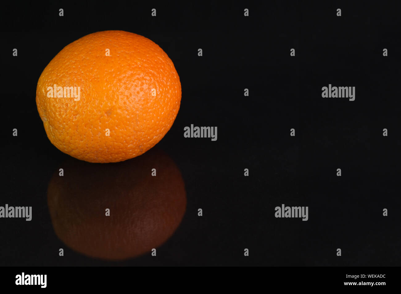 Low Key Orange Fruit isolated on black background with copy space Stock ...