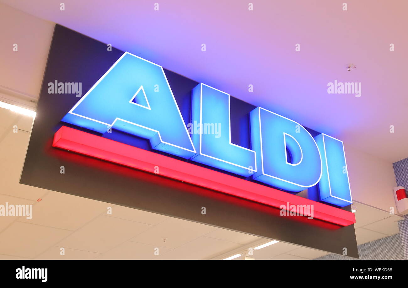 People visit ALDI Supermarket at East Side shopping mall Berlin Germany ...
