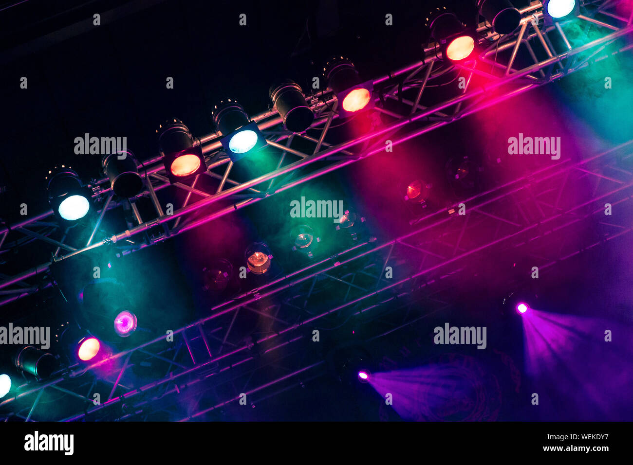 Colourful concert hall with clapping people Stock Photo - Alamy