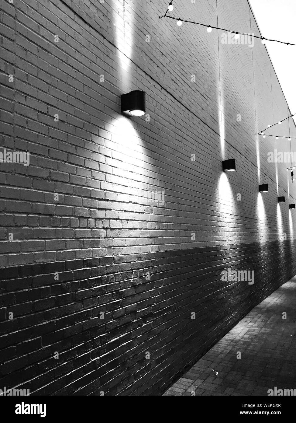 Brick wall lit up hi-res stock photography and images - Alamy