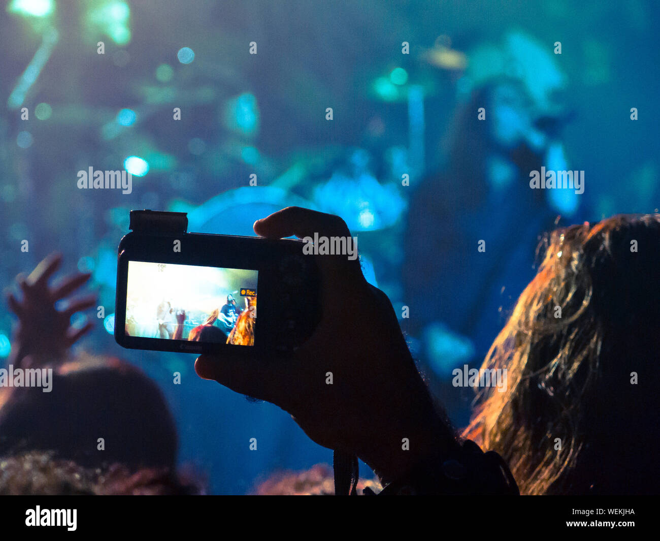 Colourful concert hall with clapping people Stock Photo - Alamy