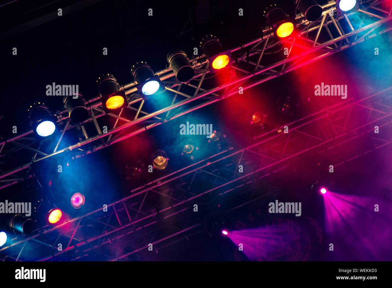 Colourful concert hall with clapping people Stock Photo - Alamy