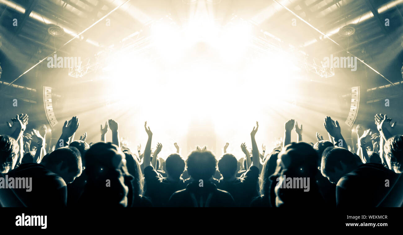 Colourful concert hall with clapping people Stock Photo - Alamy