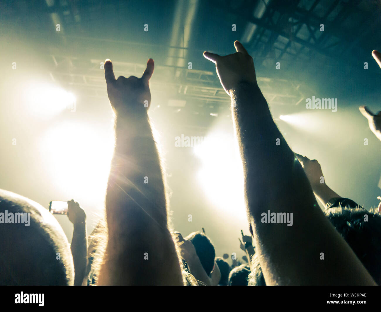 Colourful concert hall with clapping people Stock Photo - Alamy