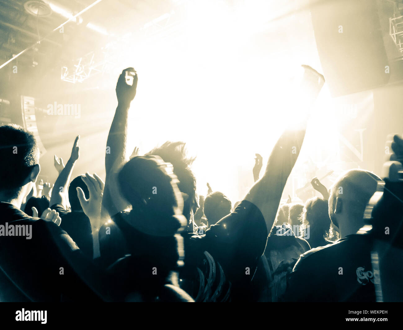 Colourful concert hall with clapping people Stock Photo - Alamy